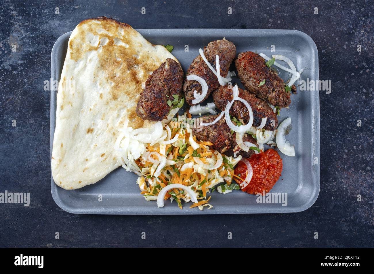 Traditional Croatian cevapi spicy meat ball rolls with cabbage carrot ...