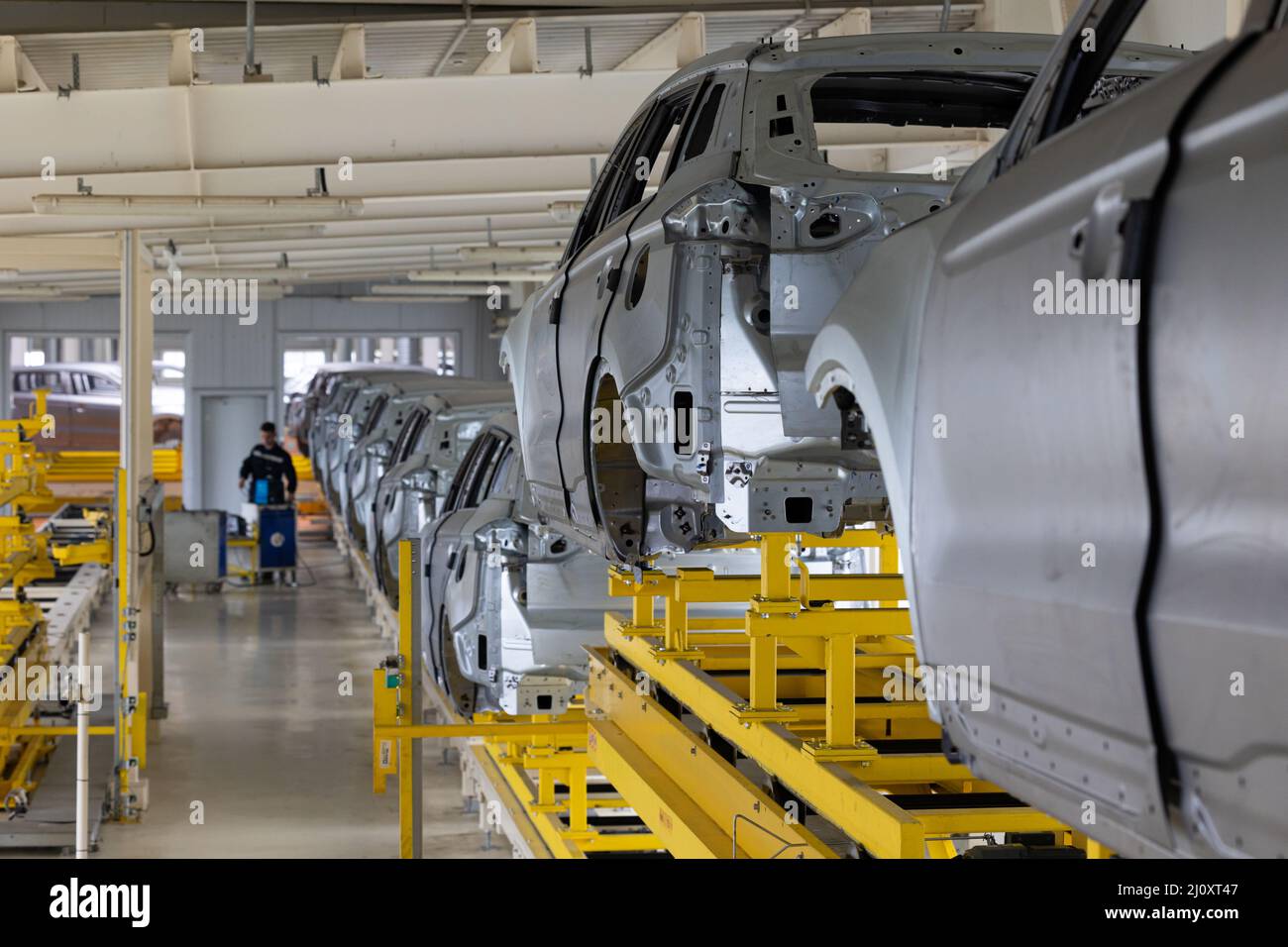 Photo of automobile production line. Modern car assembly plant. Modern ...