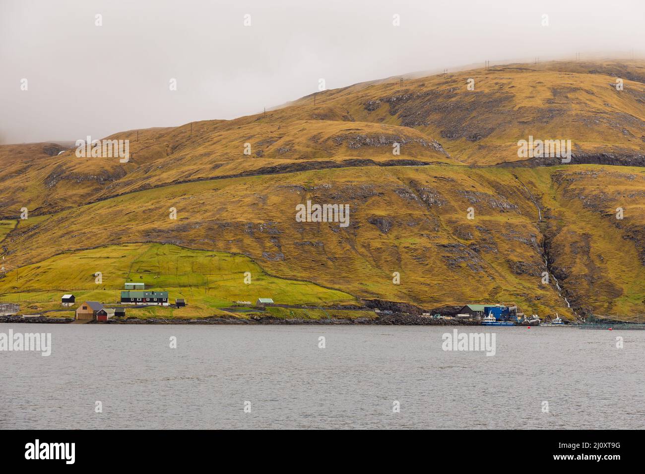 Small port town situated on the slope of the hill on Streymoy island ...