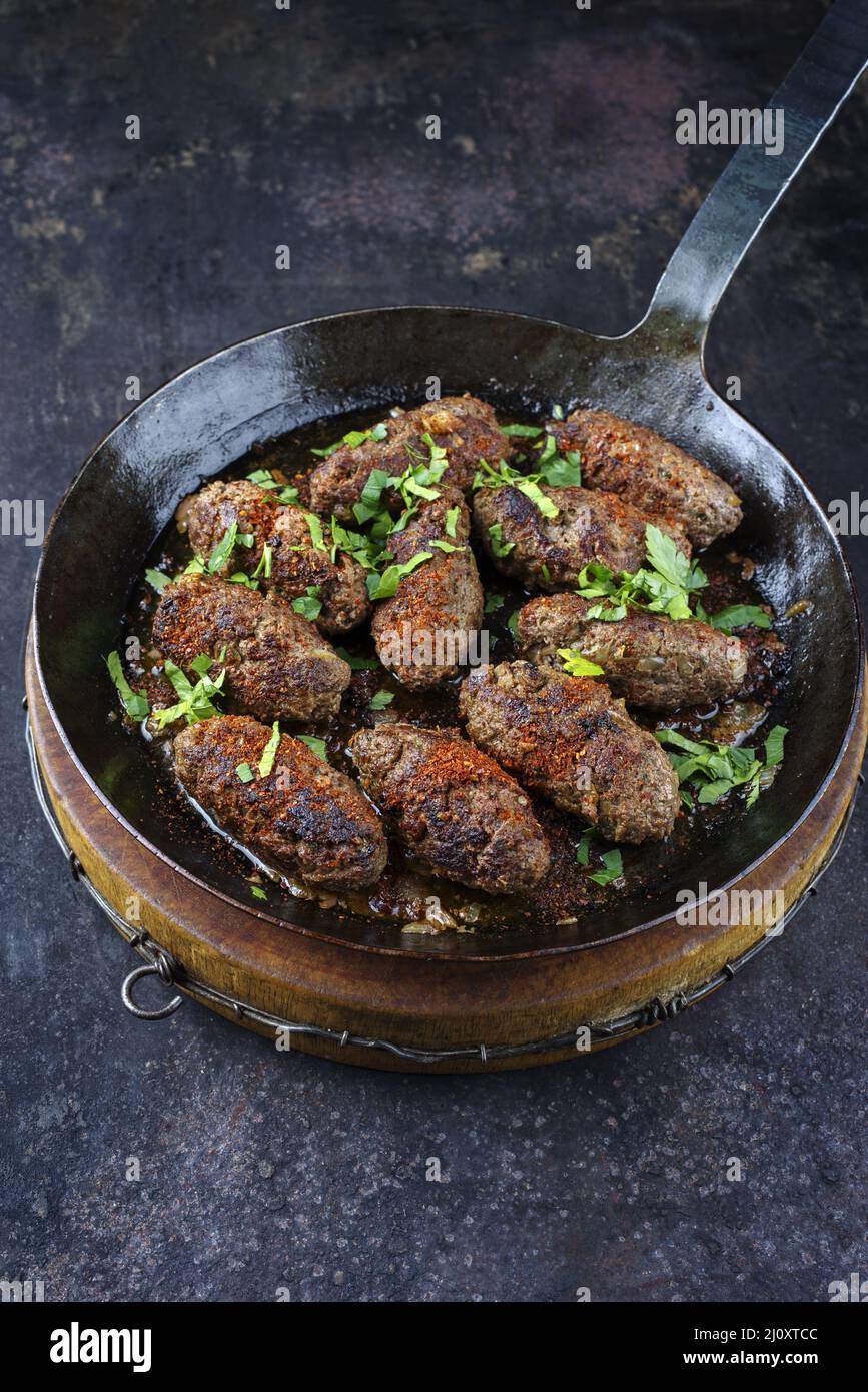 Traditional Croatian cevapcici spicy meat ball rolls with parsley and ...