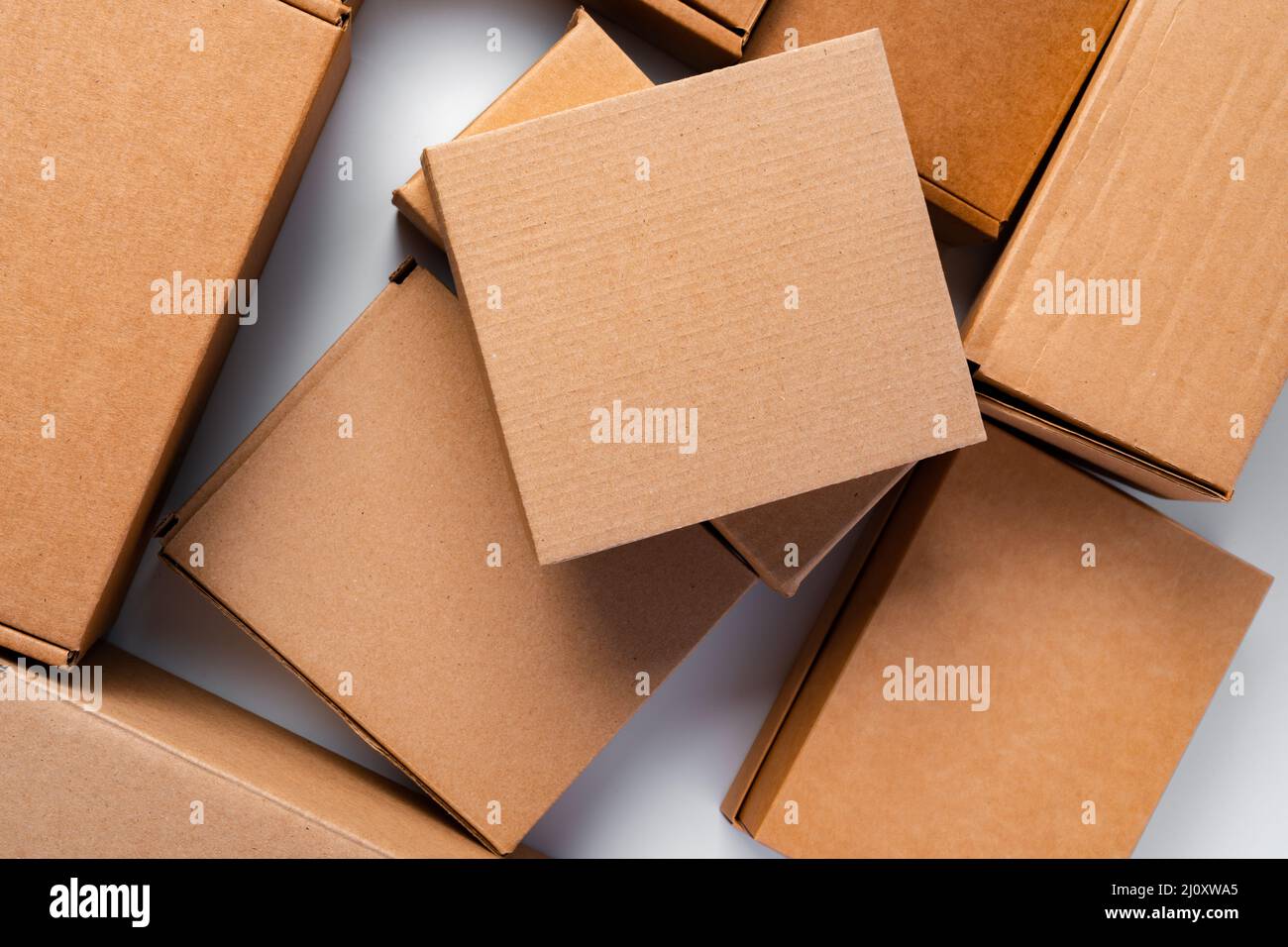 Lot of cardboard boxes on white background Stock Photo - Alamy