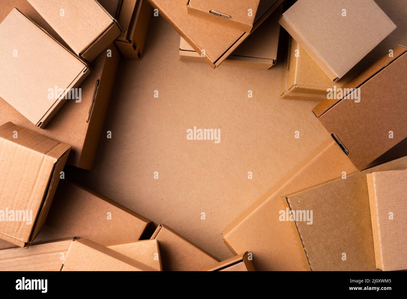 Cardboard box on beige background in studio Stock Photo - Alamy