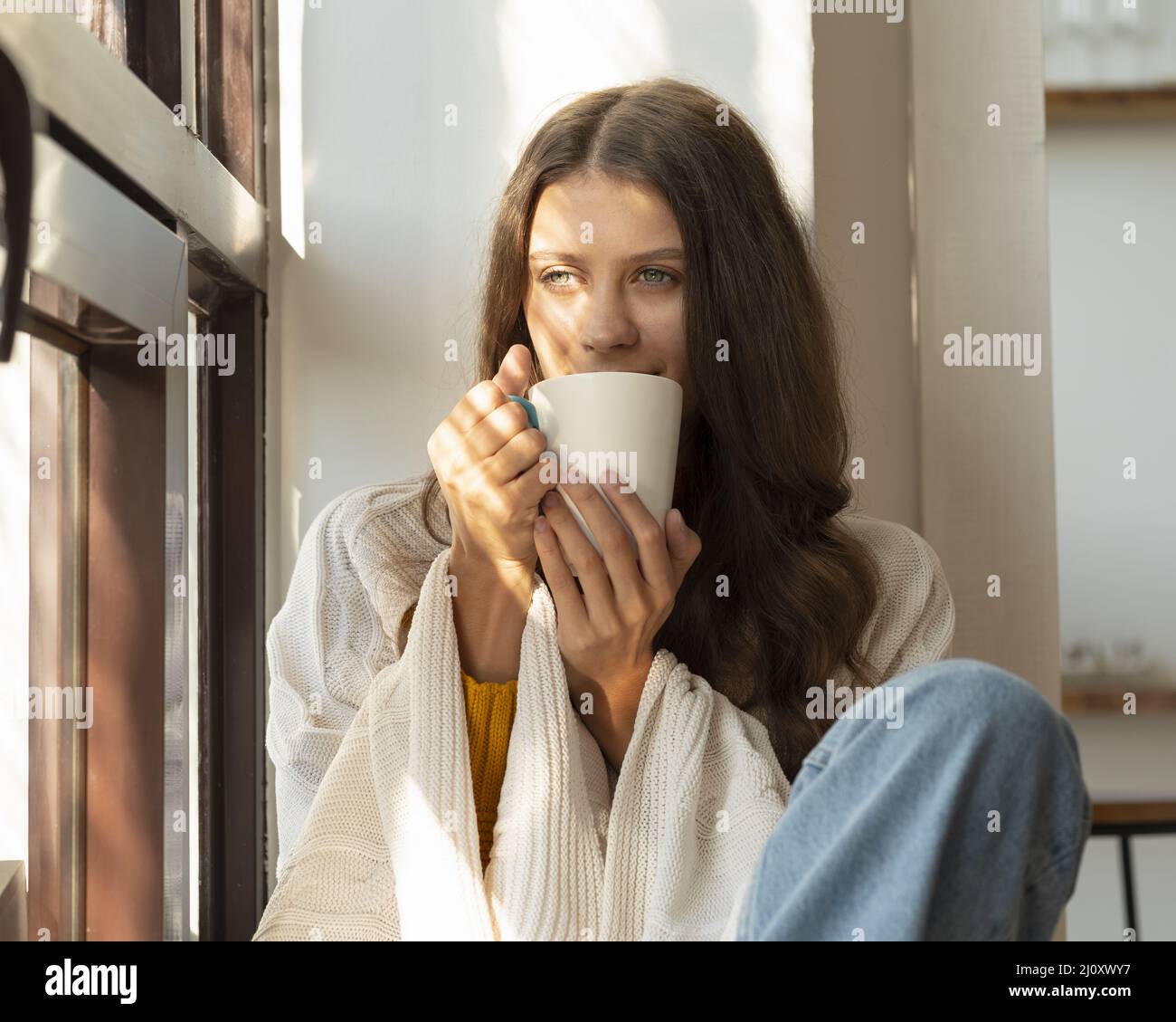 Woman drinking hot beverage hi-res stock photography and images - Alamy