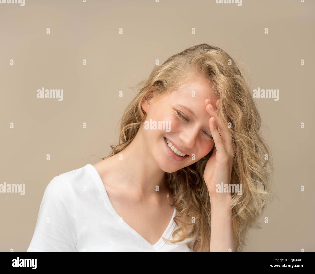 Blonde girl laughing hi-res stock photography and images - Alamy