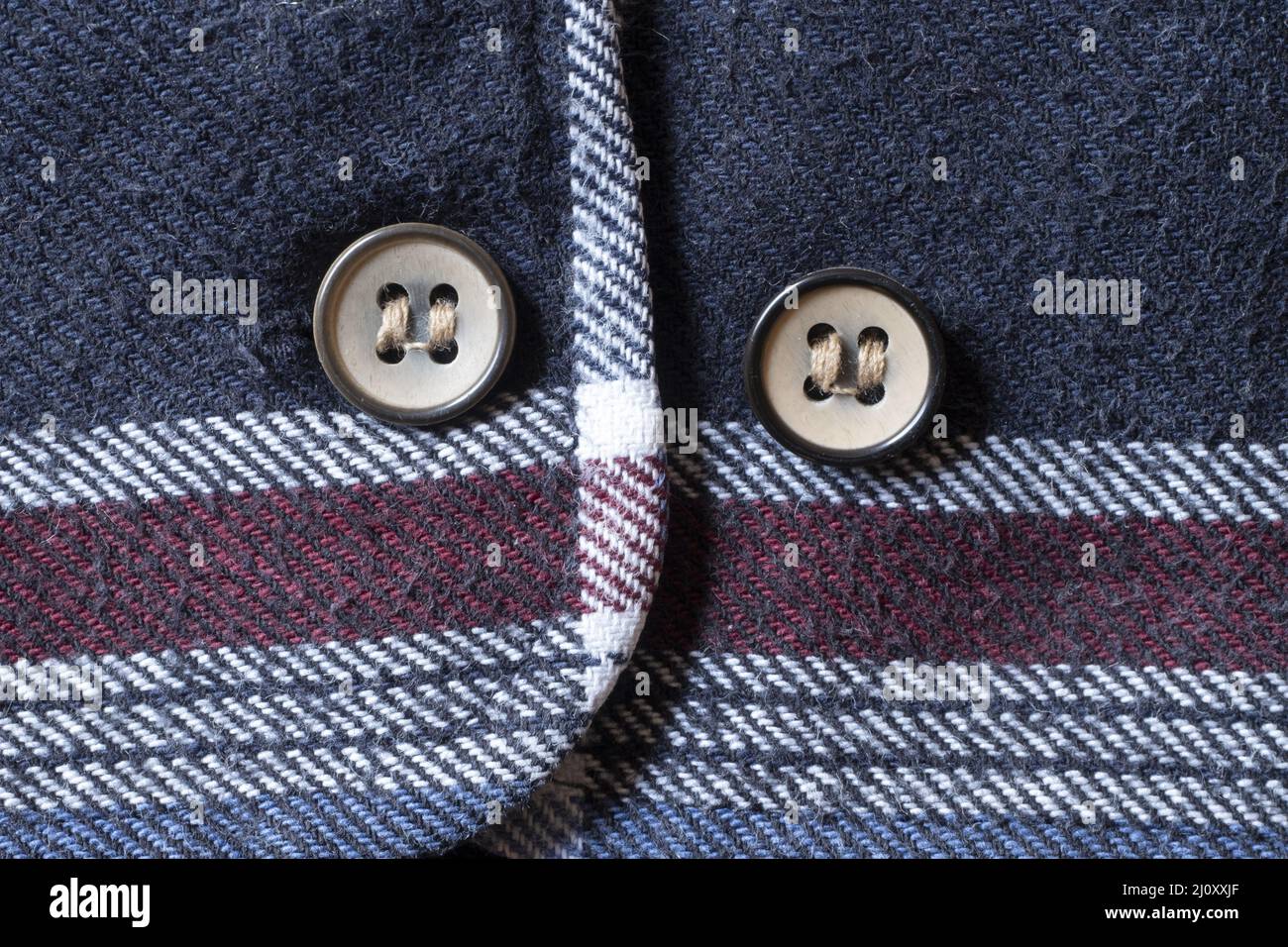 Button on a cloth Stock Photo - Alamy