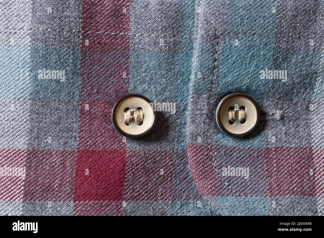 Button on a cloth Stock Photo - Alamy