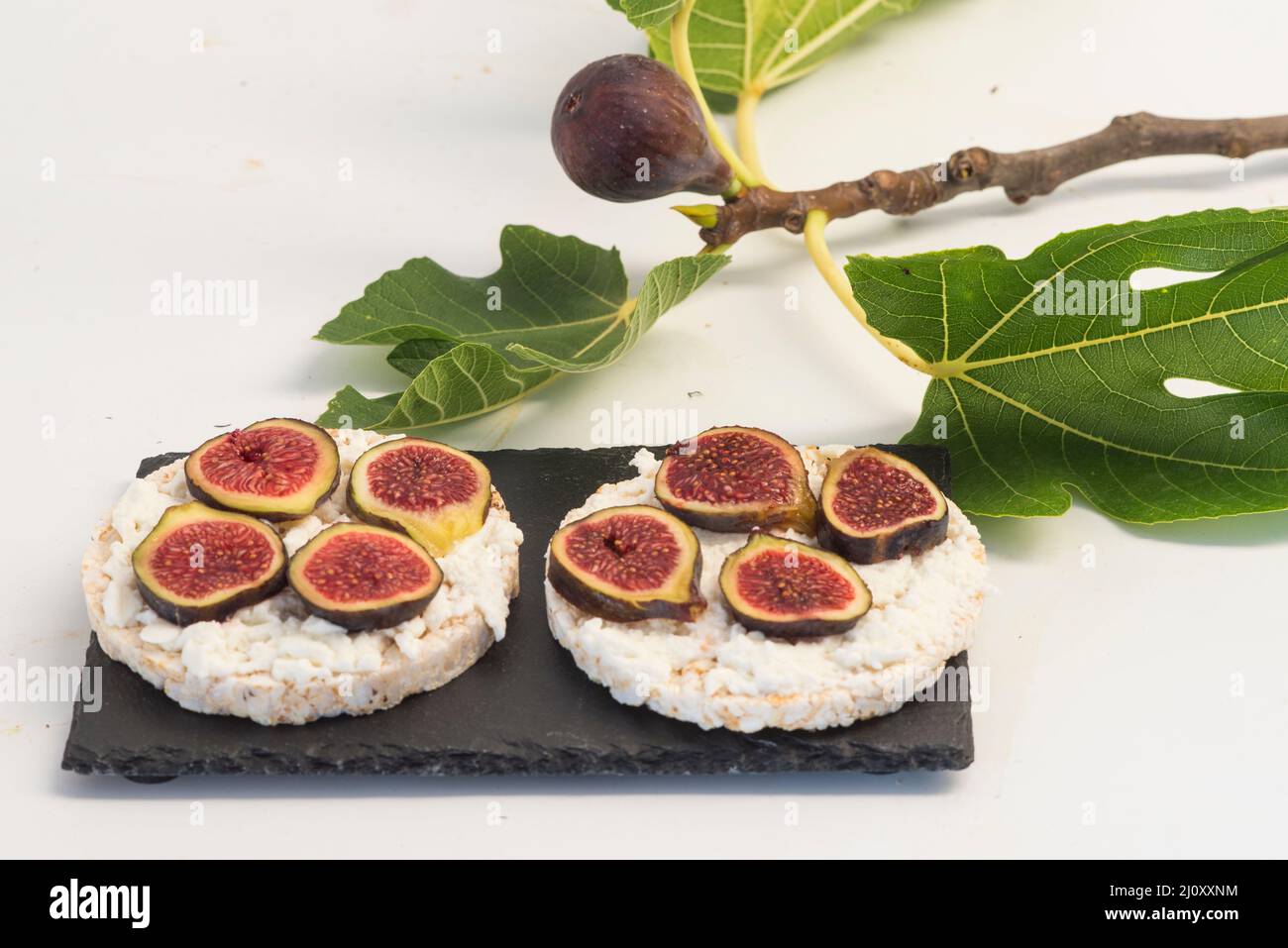 figs and cheese with bio toast Stock Photo - Alamy