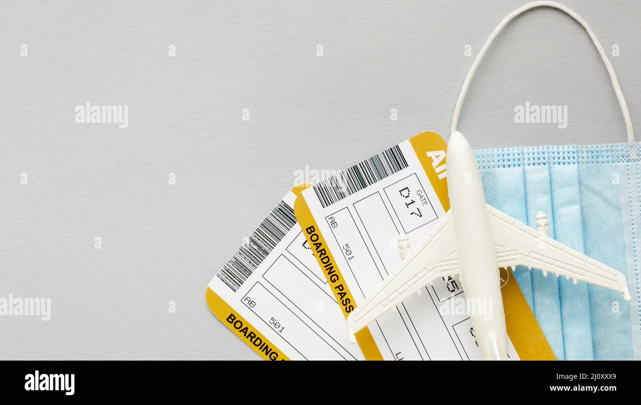 Top view plane tickets mask. High quality photo Stock Photo - Alamy