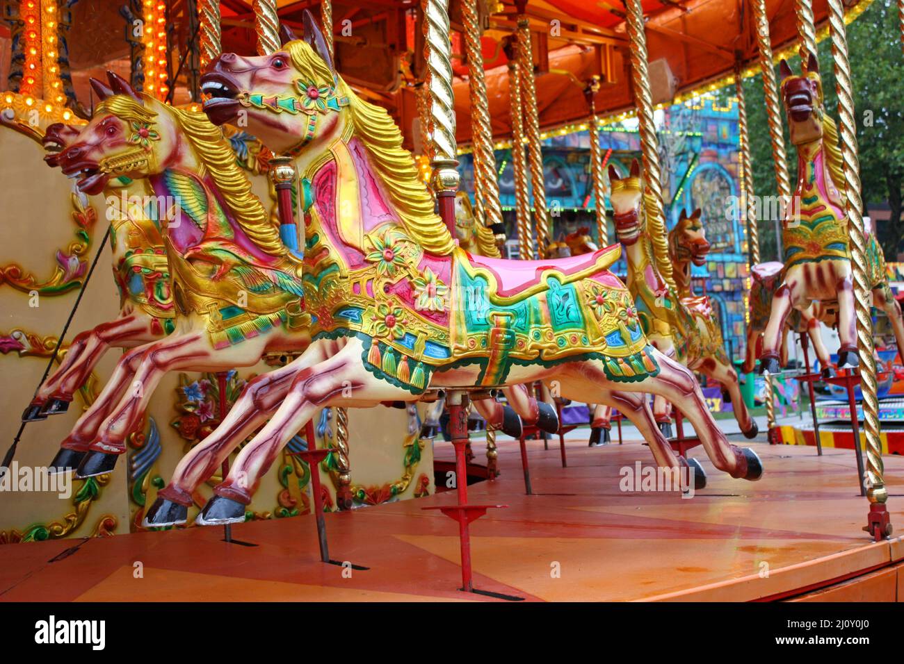 A Colourful Carousel Horse Ride at a Fun Fair Stock Photo - Alamy