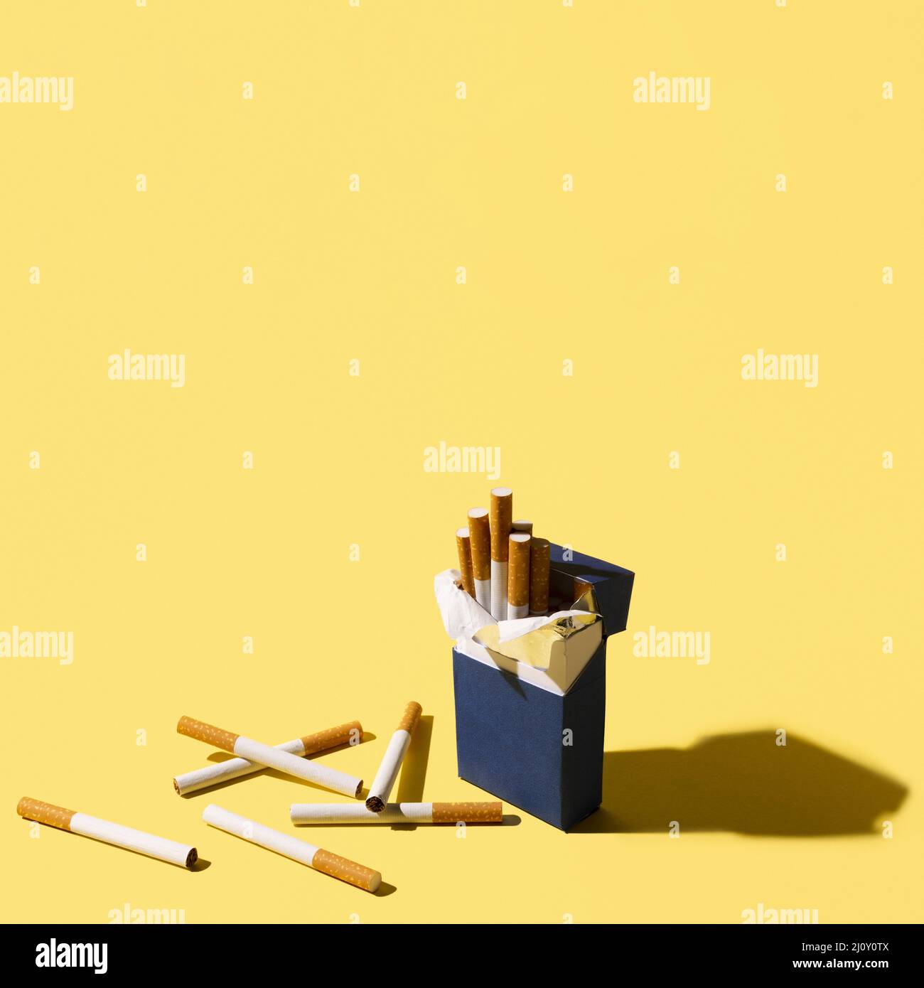 Cigarettes pack yellow background. High quality photo Stock Photo - Alamy