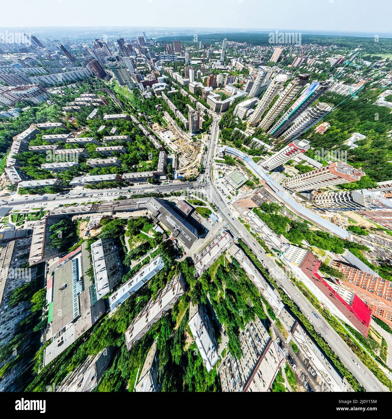 Aerial city view with crossroads and roads, houses, buildings, parks ...