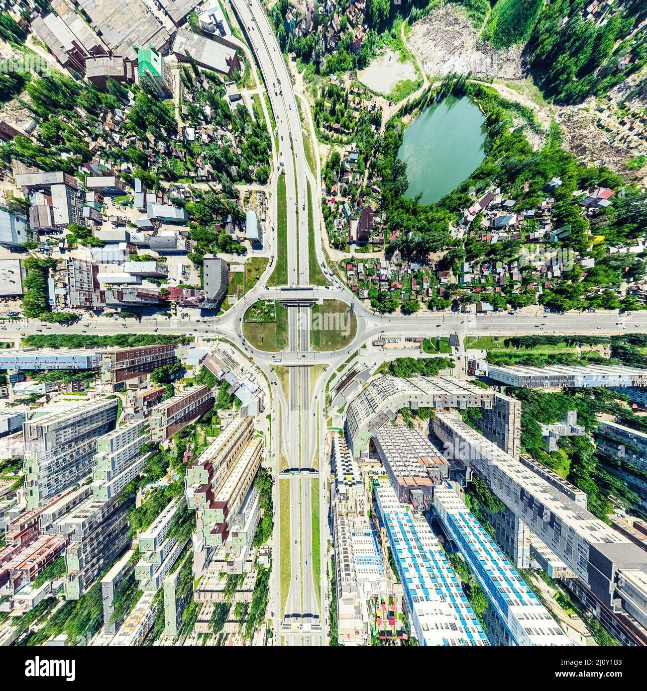 Aerial city view with crossroads and roads, houses, buildings, parks ...