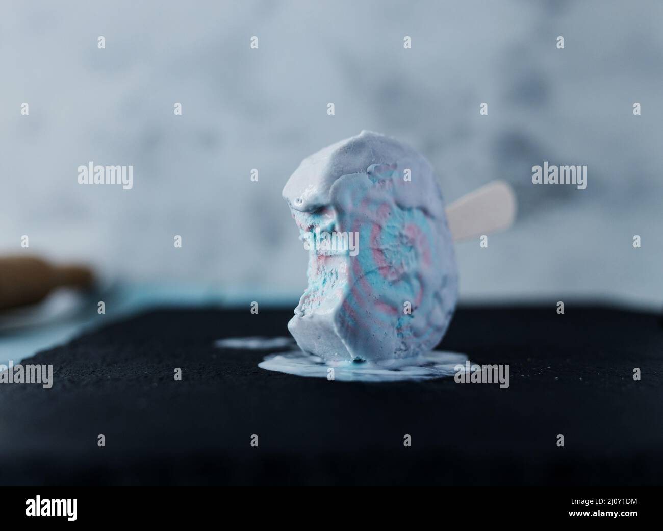 bright ice cream on a stick. sweet refreshing dessert. bite Stock Photo ...