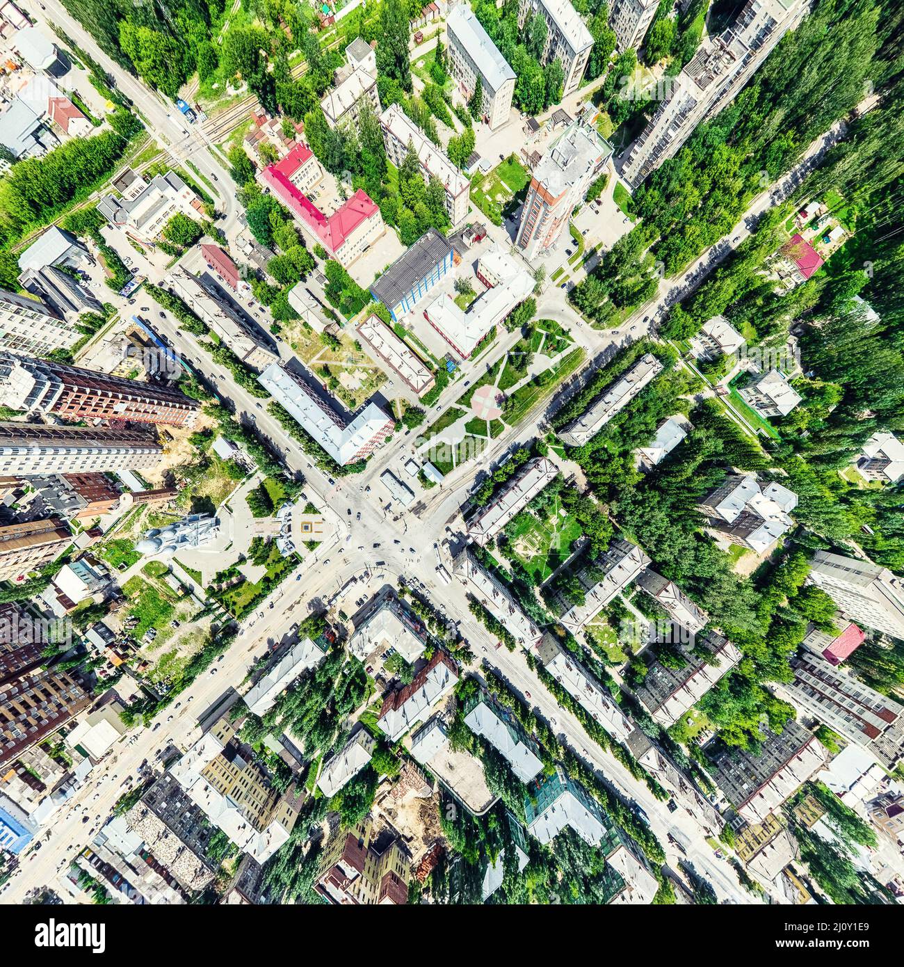 Aerial city view with crossroads and roads, houses, buildings, parks ...