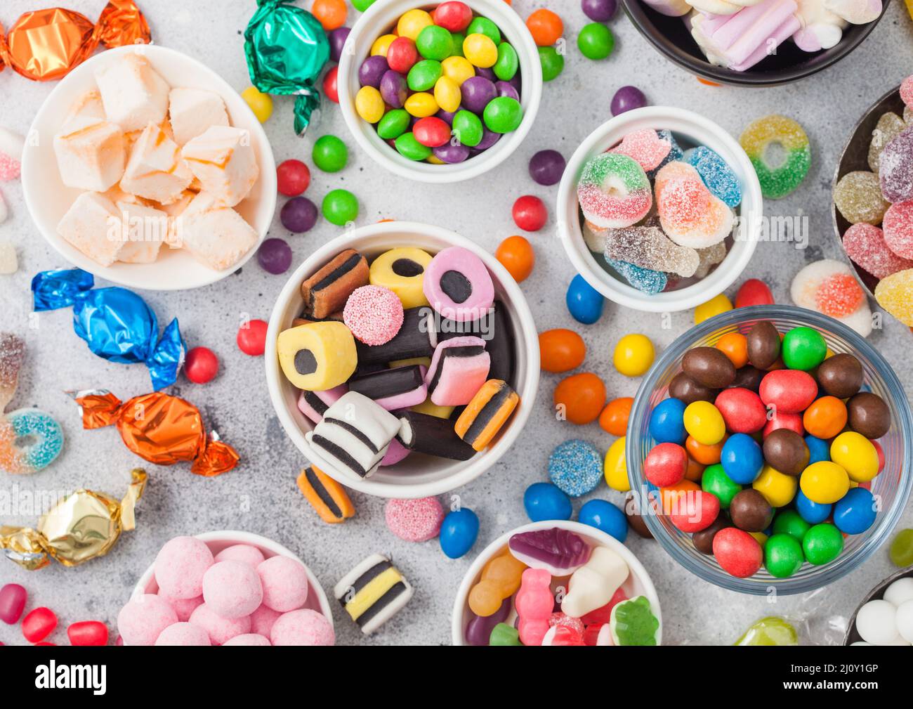 Milk chocolate candies woth shell in jar with various jelly gums ...