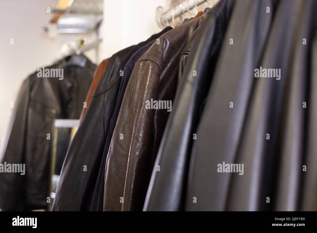 Collection of leather jackets in shop Stock Photo - Alamy