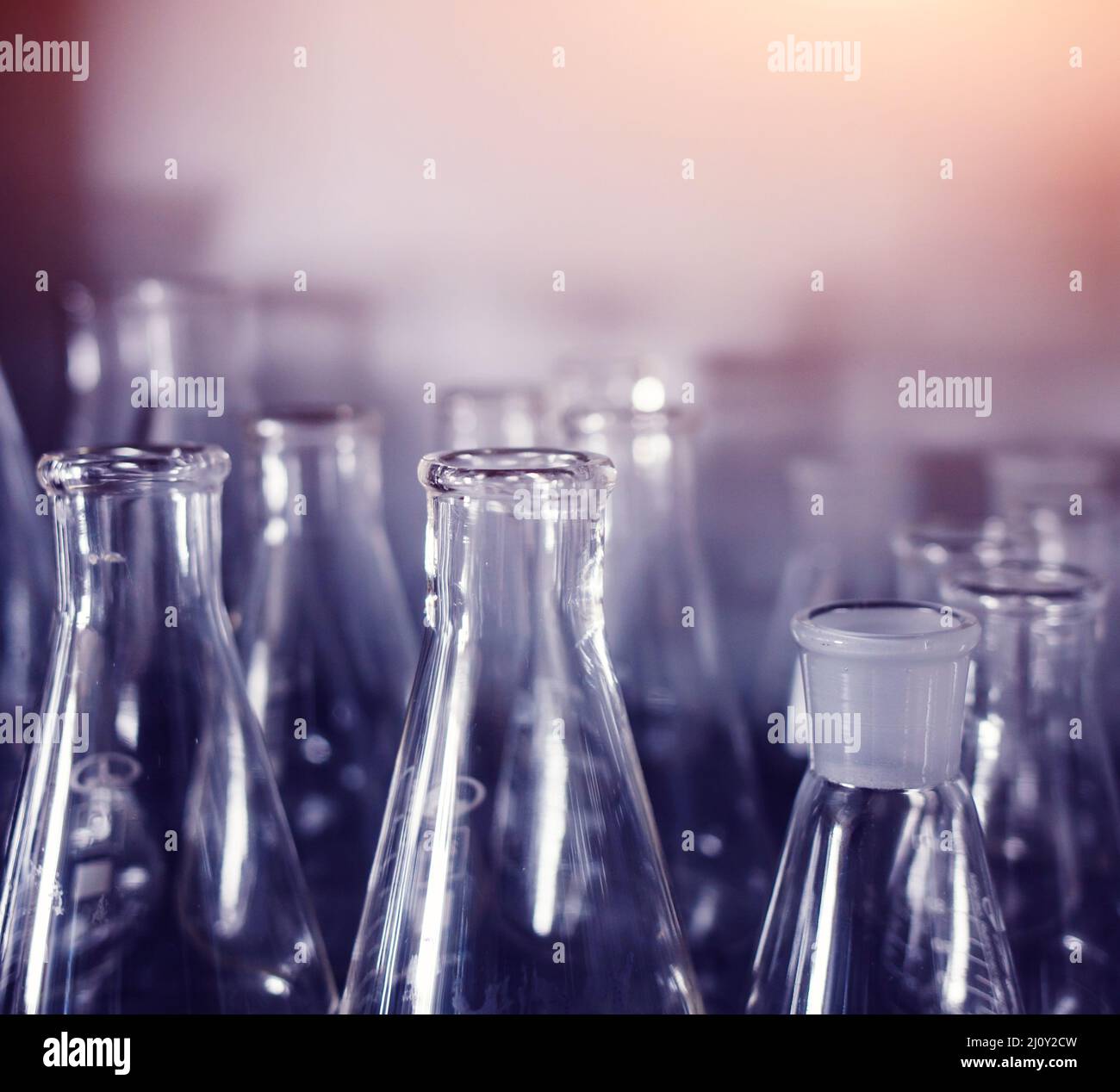 Laboratory glassware. Glass flasks in table Stock Photo - Alamy