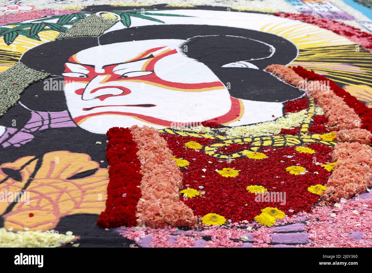 Tokyo, Japan. 21st Mar, 2022. A huge kabuki actor picture made with ...