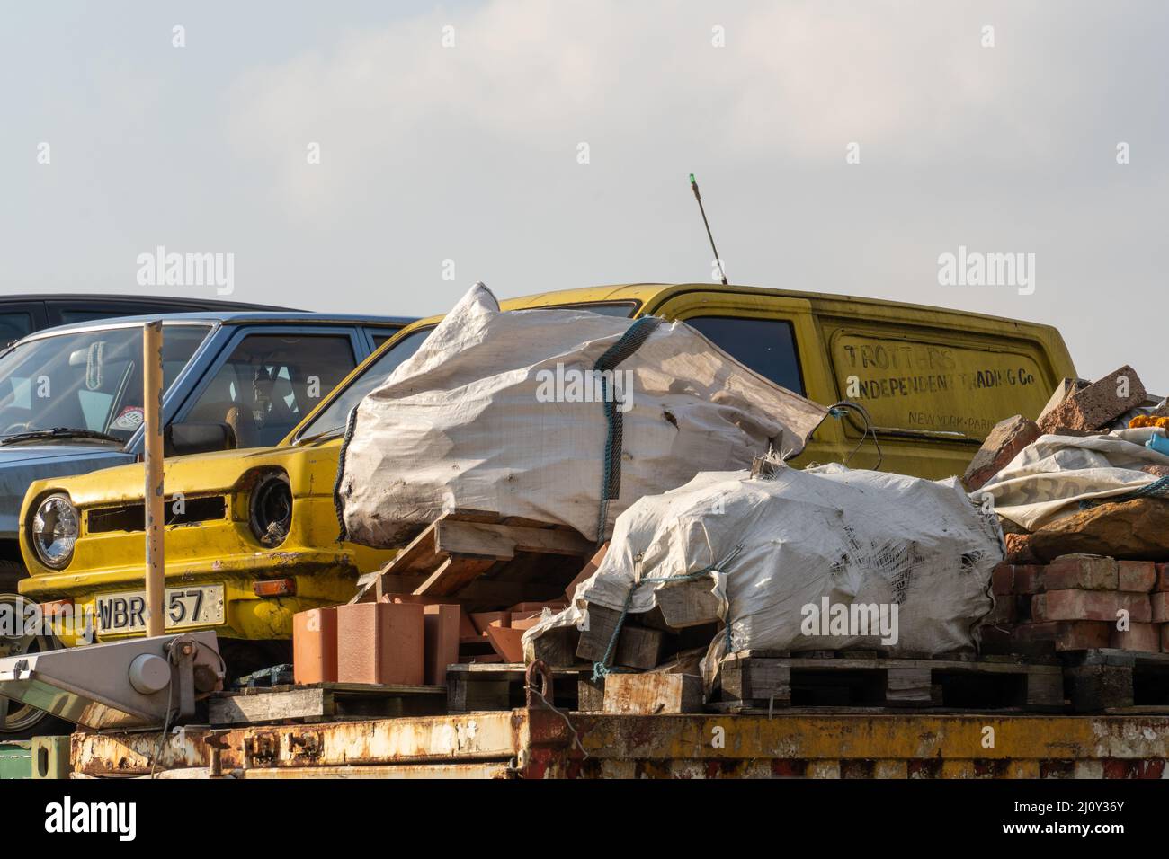 Cars on a scrap heap, awaiting recycling as spare parts. Hebburn, South ...