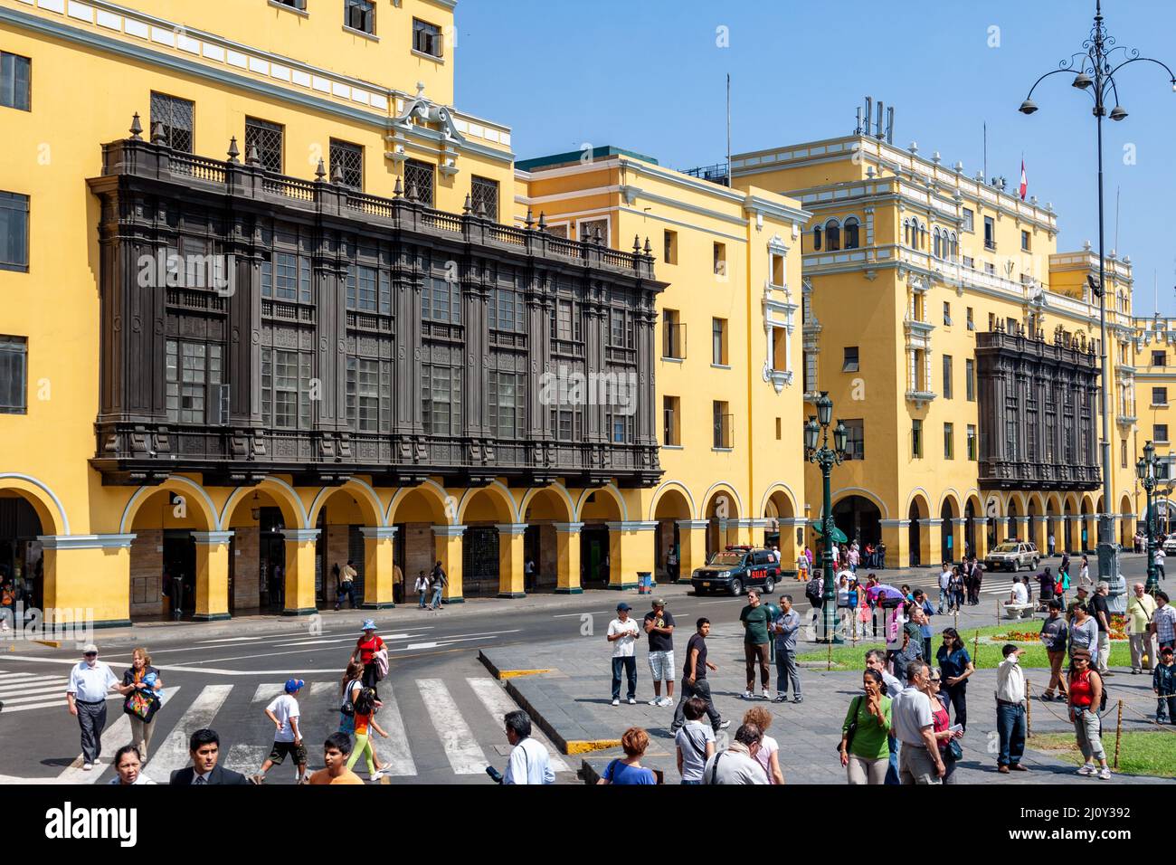 Historical buildings with yellow facade in Plaza de Armas, Lima, Peru ...