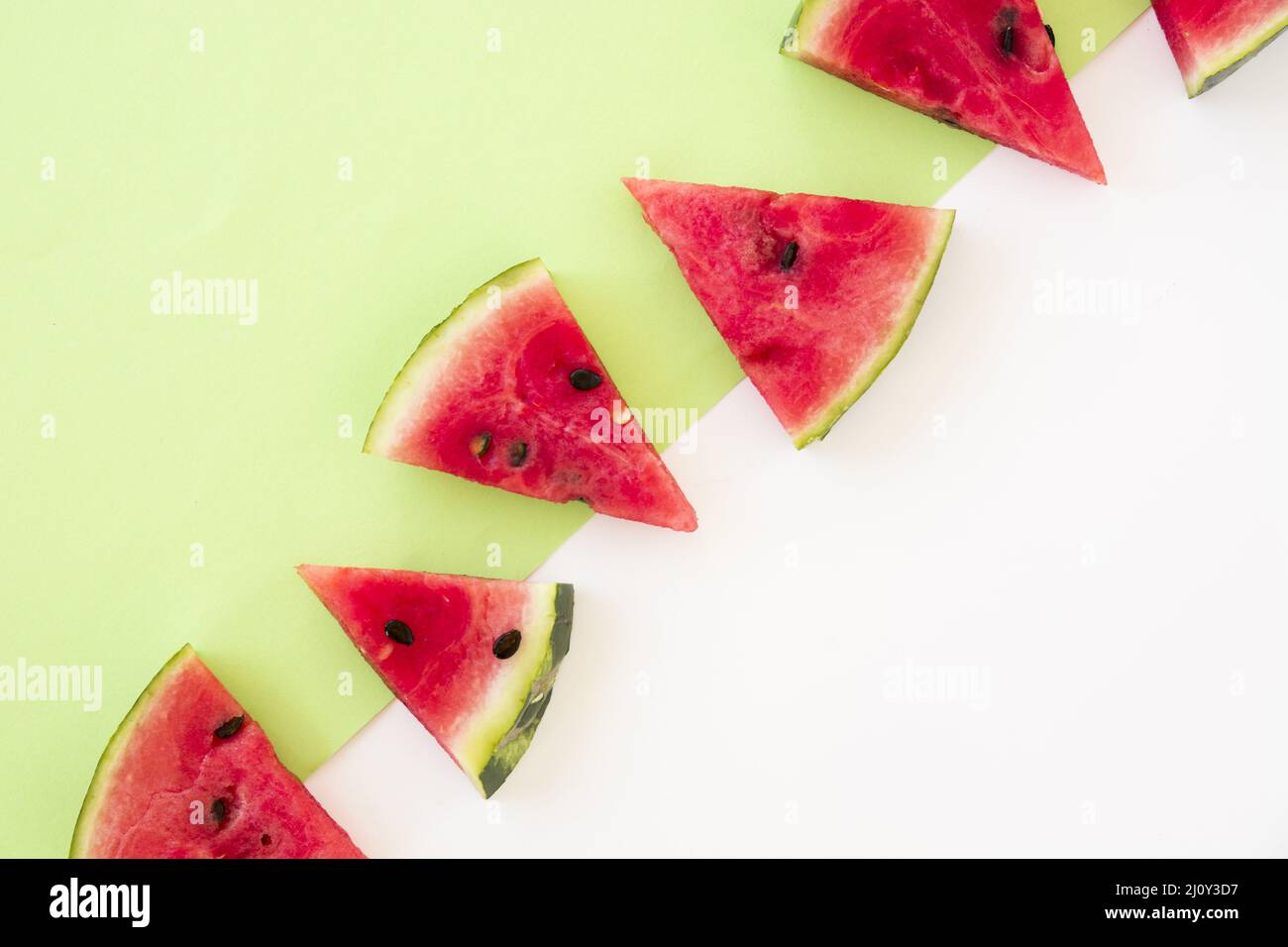 Triangular shape watermelon slices dual background. High quality photo ...