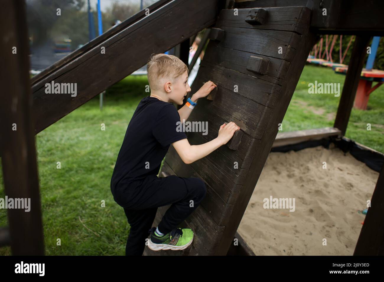 the boy goes through an obstacle course, goes in for active sports ...