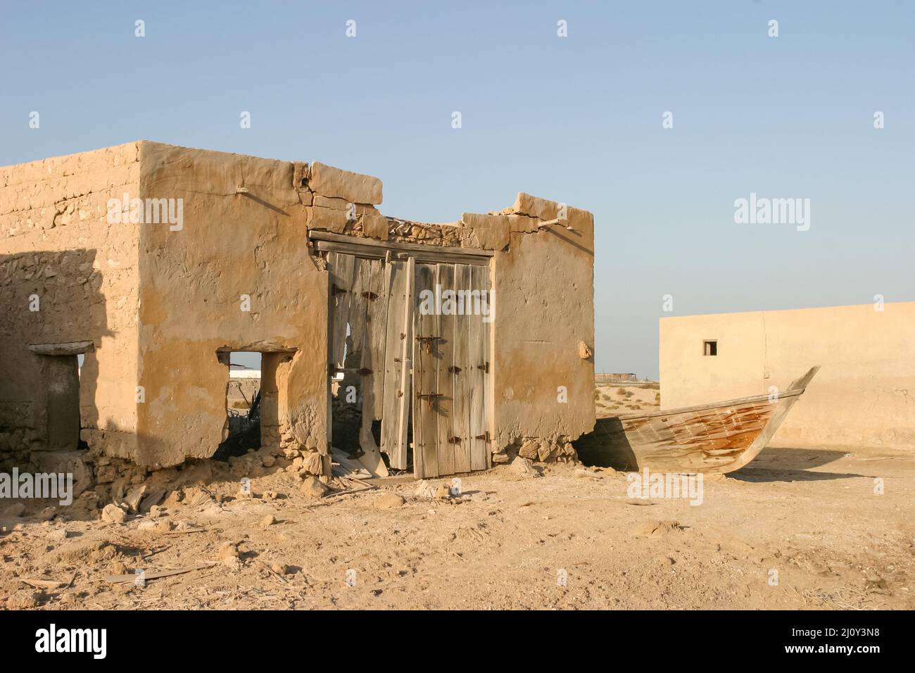 An old shed and fishing boat in Al Jazirat Al Hamra, ab abandoned ghost ...