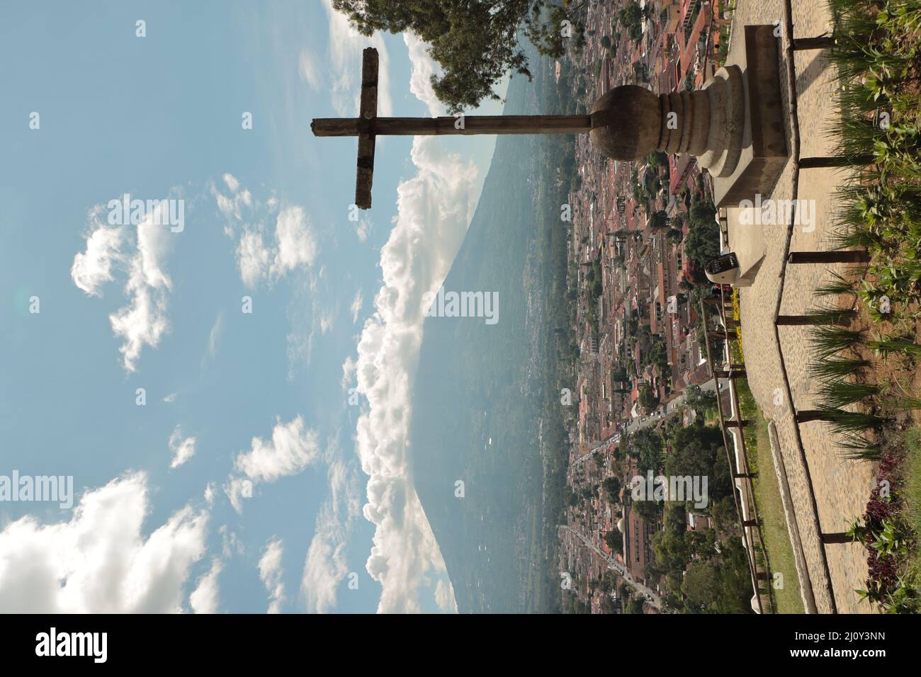 Vertical shot of a cross on the town background Stock Photo - Alamy