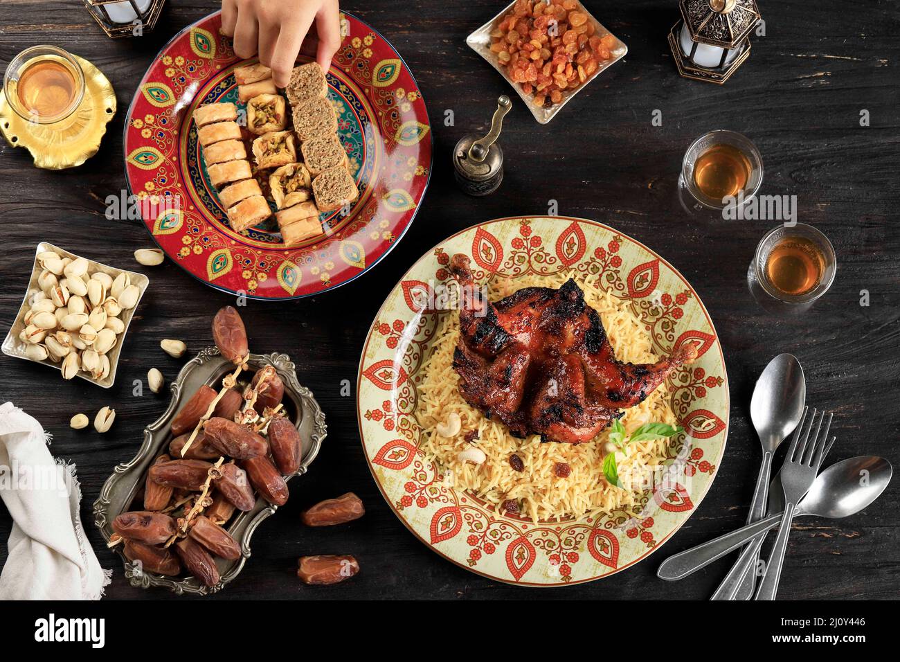 Female Hand Pick Turkish Baklava on Plate, Table Setting for Ramazan ...