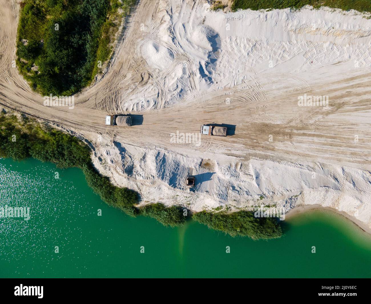 heavy industry overhead view of excavator at sand quarry summer sunny ...