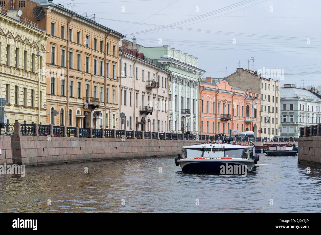 Tourist boats on the canal through the historic city of St Petersburg ...