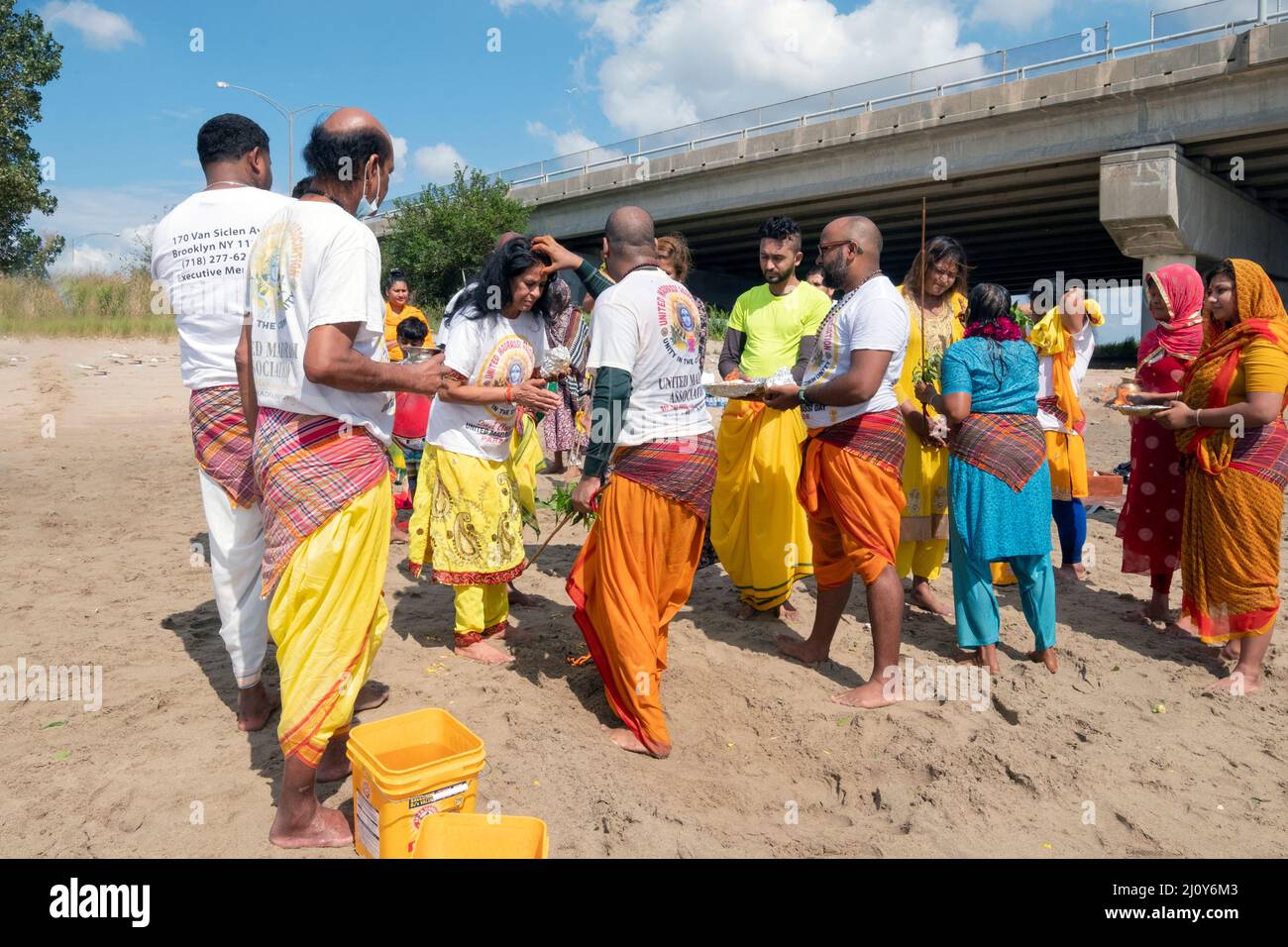 Devout Hindus at a Ganga and Kateri Amma Poosai service at Jamaica Bay ...