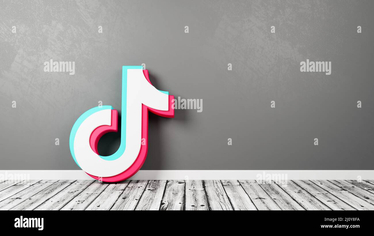 Tiktok Logo On Wooden Floor Against Wall Stock Photo Alamy