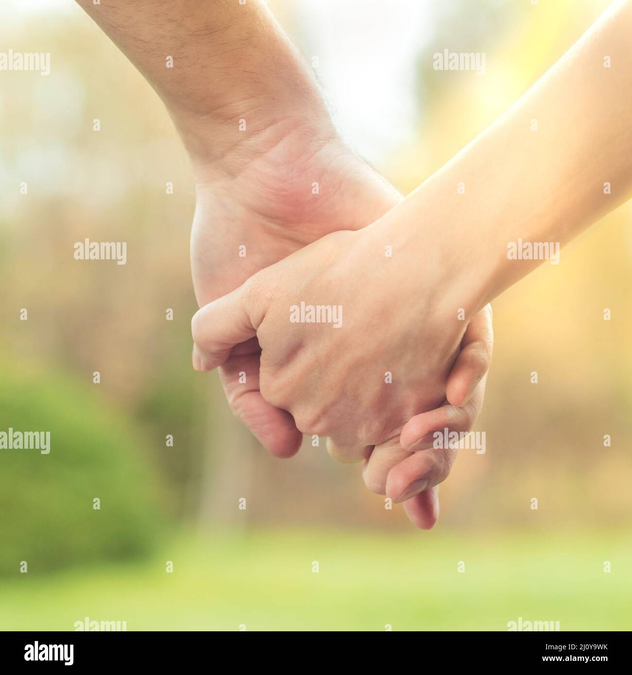 Two hands holding together hi-res stock photography and images - Alamy