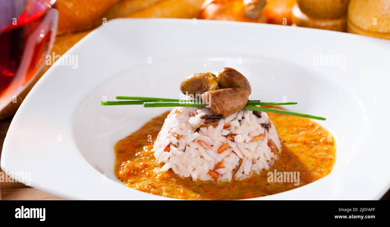 Fried chicken heart with rice in a sea of hot tomato cream sauce Stock ...