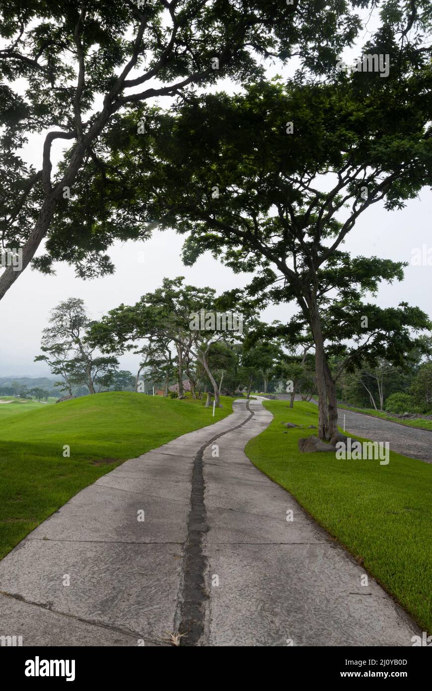 Concrete road on a golf course called La Reunion in Guatemala ...