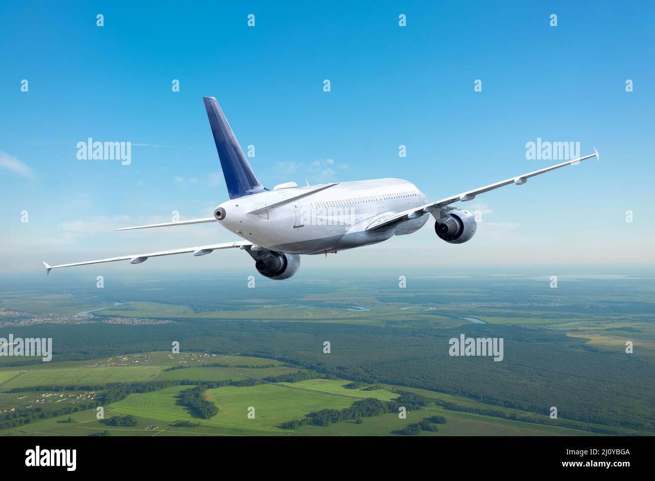 Commercial airliner with a roll performs a mid-flight turn while ...
