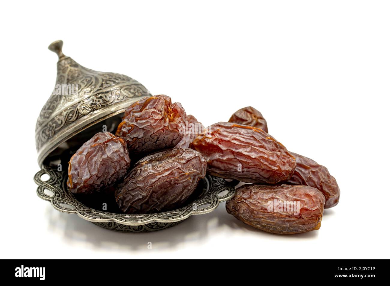 Date fruit isolated on a white background. Date fruits on a rustic ...