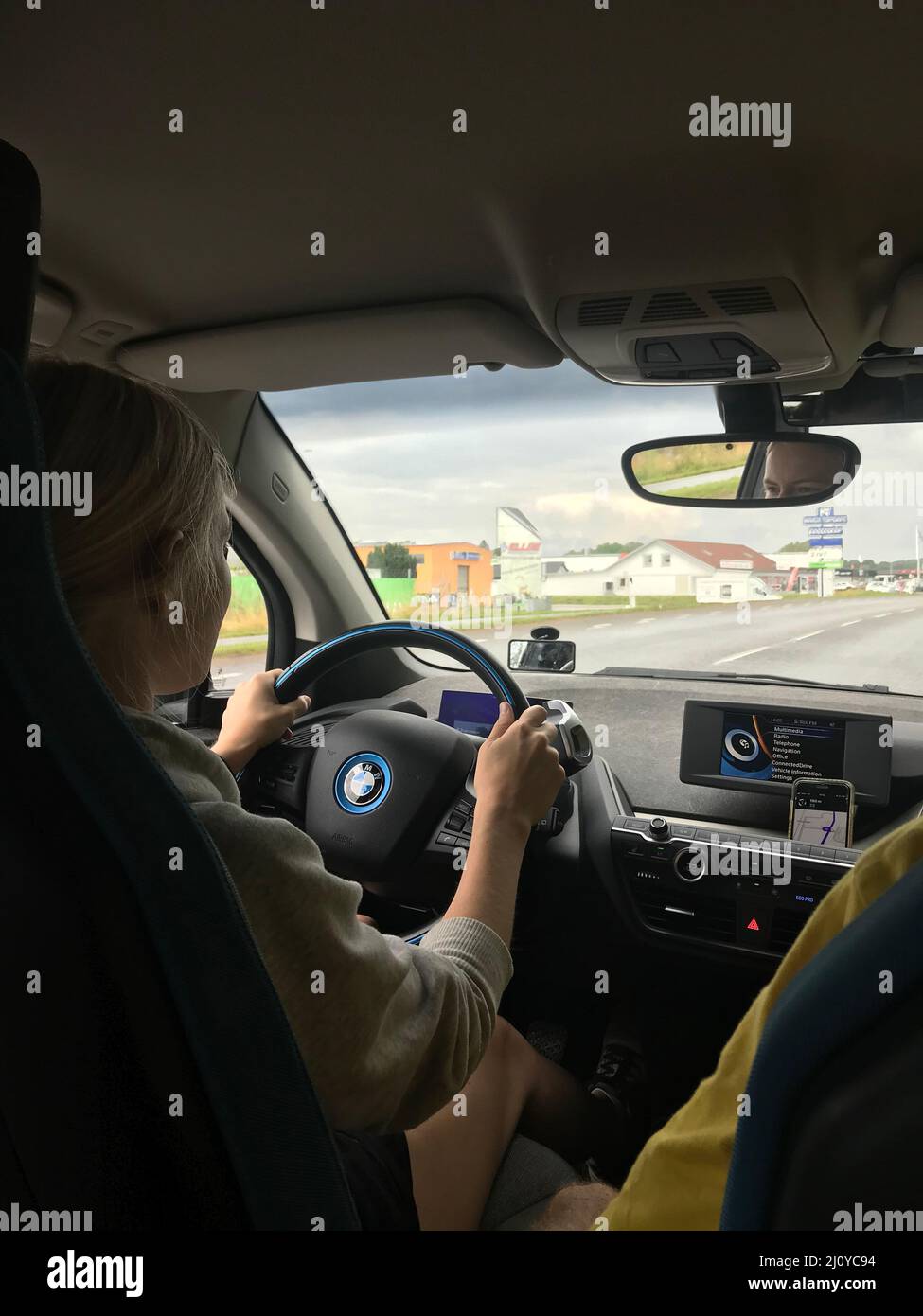 Photo of a young woman practicing driving car for driving license Stock ...