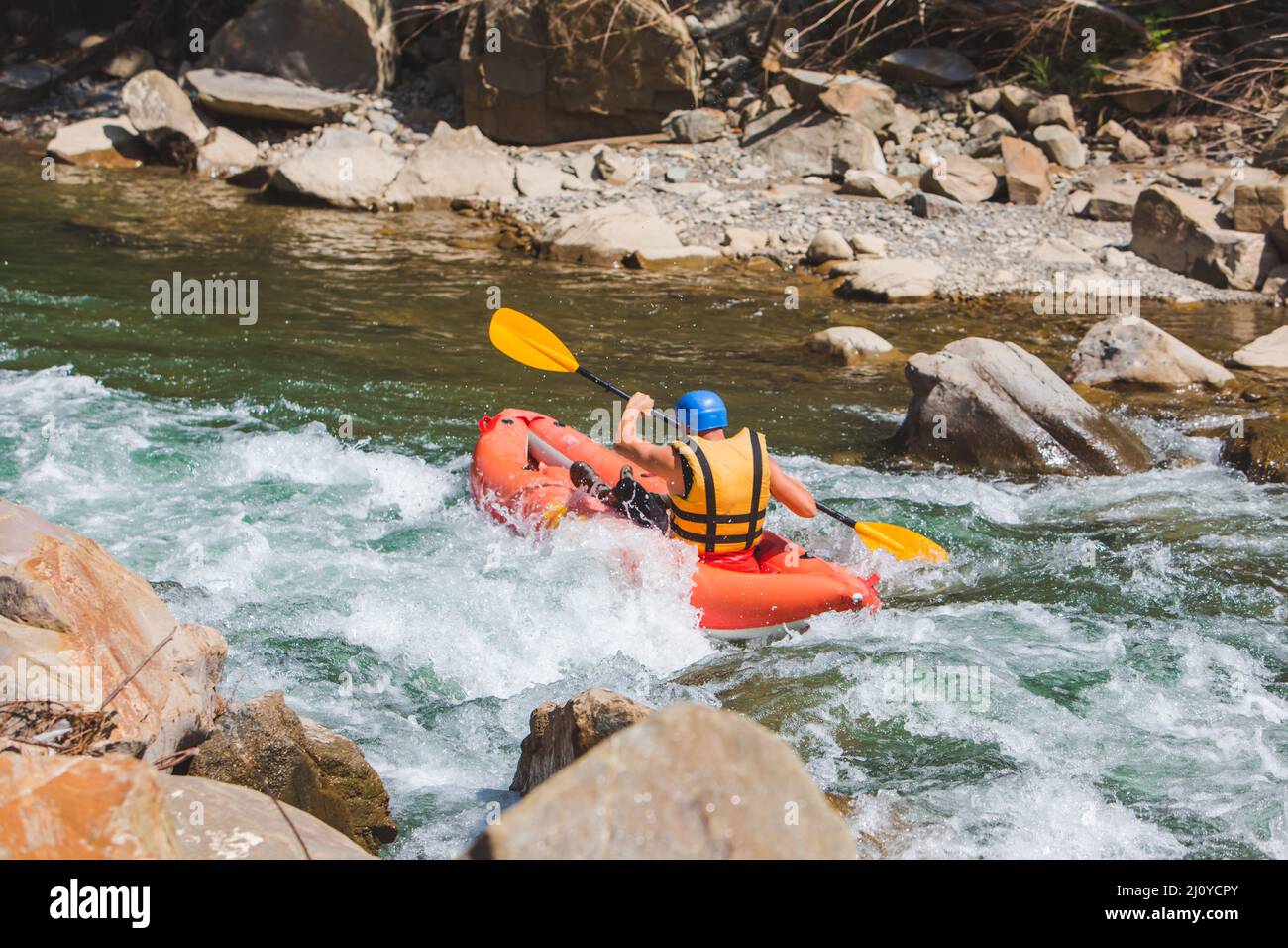inflatable raft extreme sport at mountain river Stock Photo - Alamy