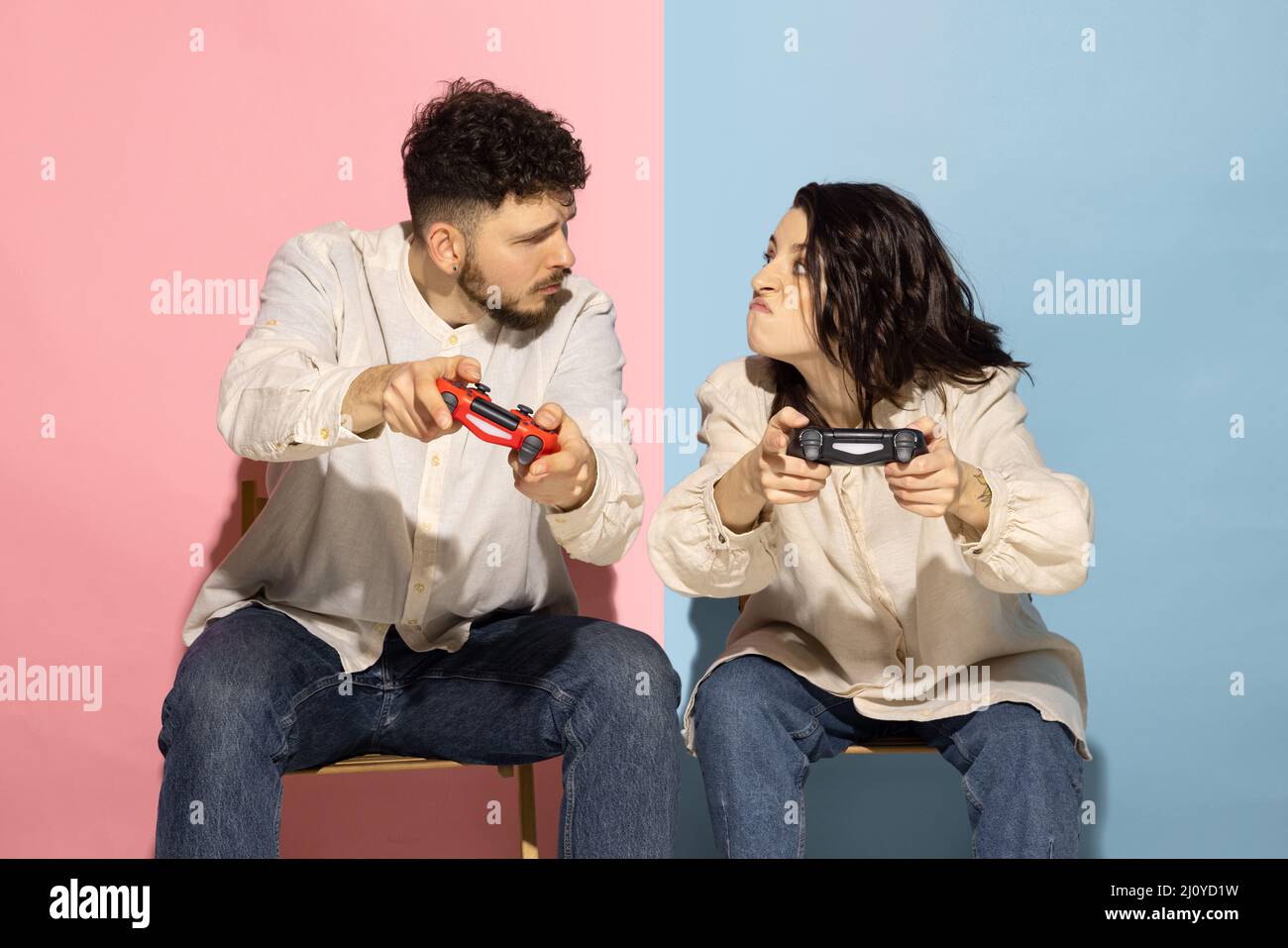 Married couple, young emotive man and girl isolated on blue and pink ...