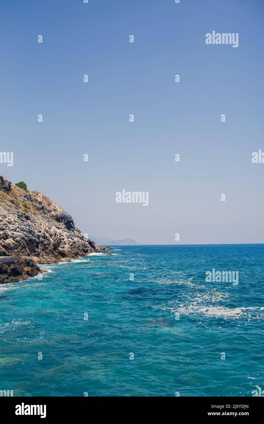 Wonderful views of the blue Mediterranean Sea. Sunny rocks, waves with ...