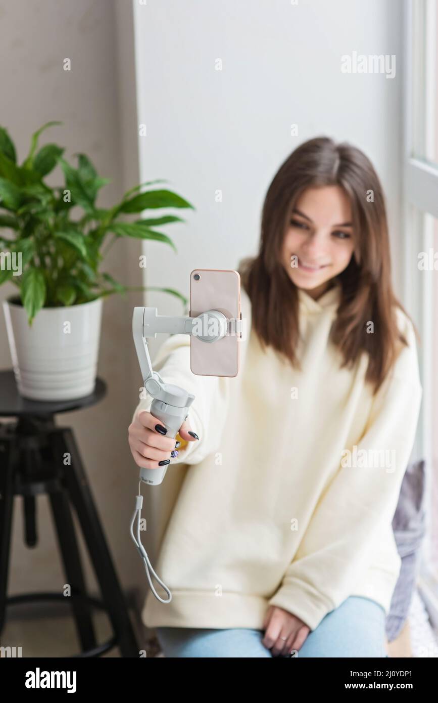 Happy generation z teenager girl, smiling face, talking on smartphone ...