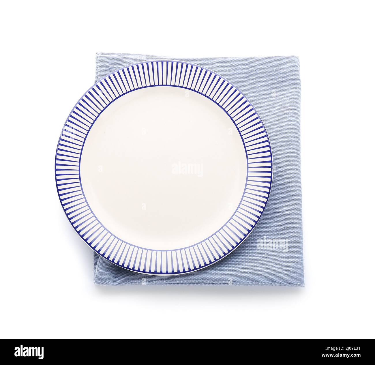 Plate with napkin on white background Stock Photo - Alamy