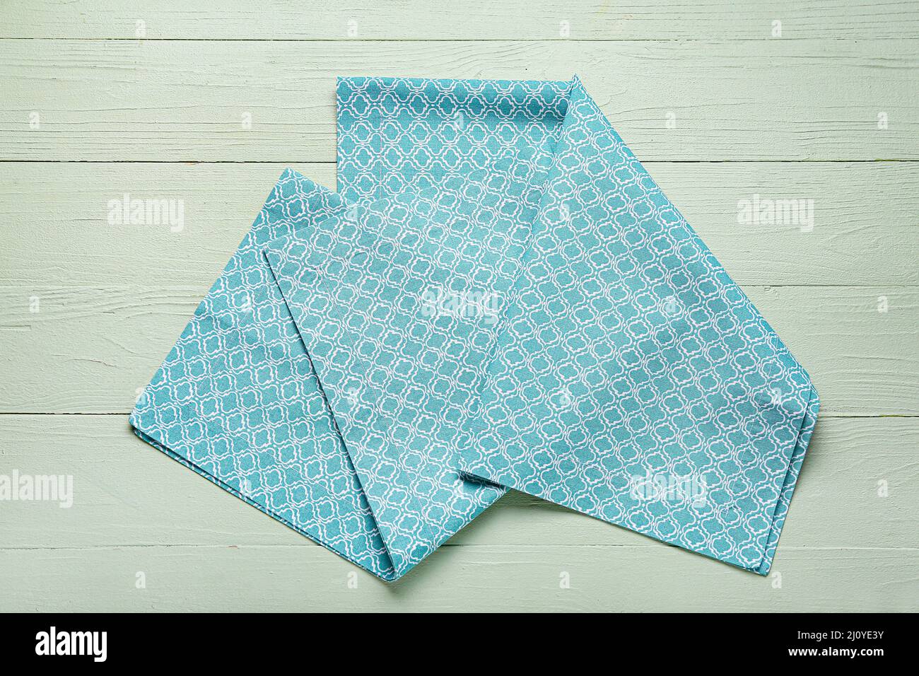 Clean napkins on color wooden background Stock Photo - Alamy