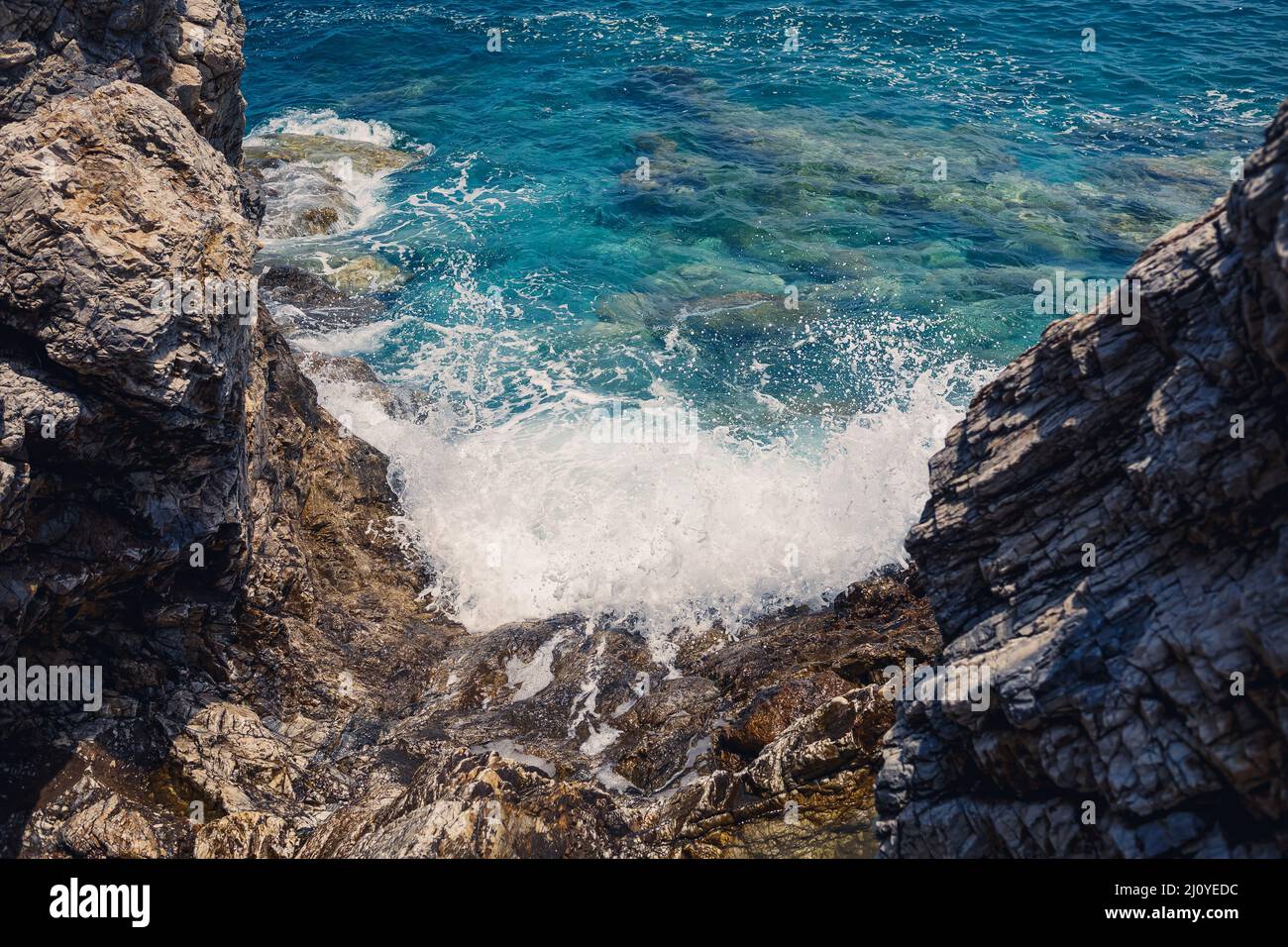 Wonderful views of the blue Mediterranean Sea. Sunny rocks, waves with ...