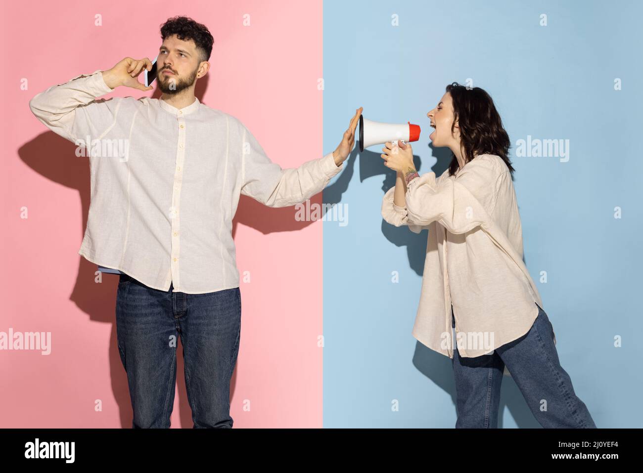 Married couple, young emotive man and girl isolated on blue and pink ...
