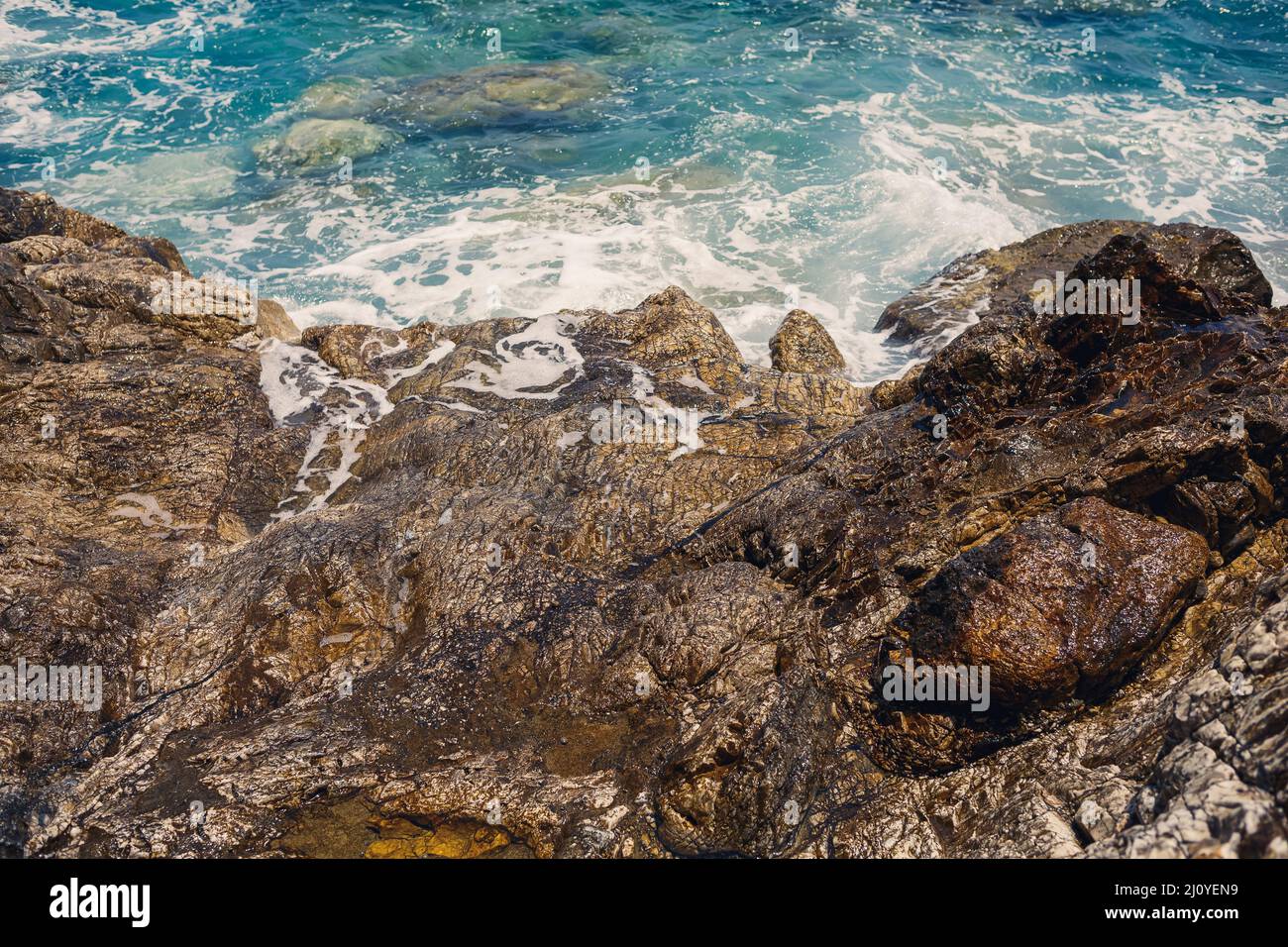 Wonderful views of the blue Mediterranean Sea. Sunny rocks, waves with ...