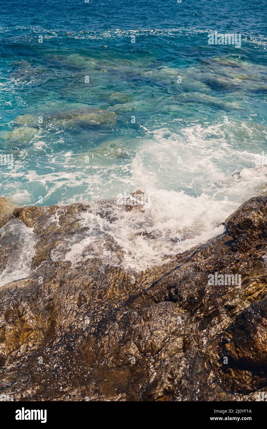 Wonderful views of the blue Mediterranean Sea. Sunny rocks, waves with ...