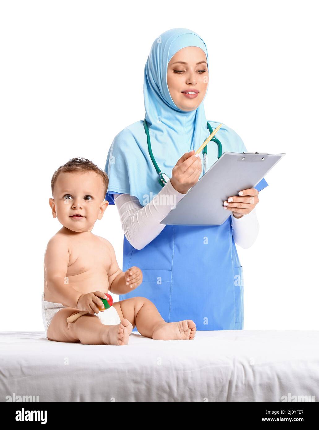 Muslim pediatrician examining baby boy on white background Stock Photo ...